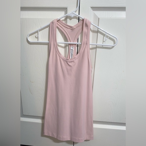 lululemon athletica | Tops | Lululemon Nulu Racerback Light Pink Tank ...